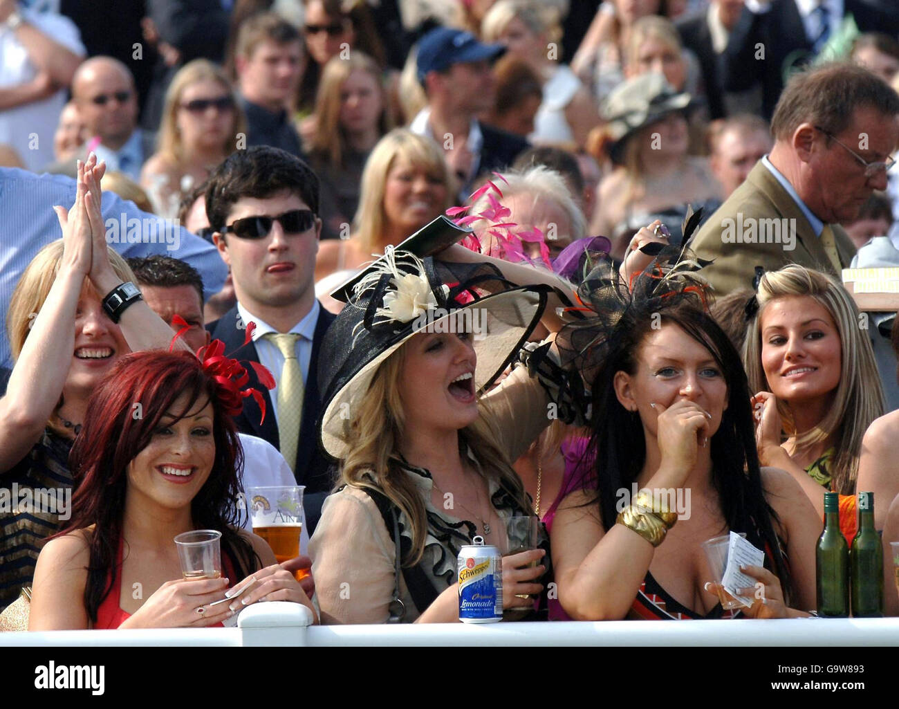 Racegoers enjoy the sunshine at Aintree racecourse on Ladies Day Stock ...