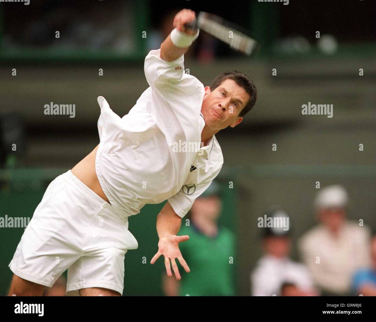 Tim henman shows a lovely service action hi-res stock photography and ...