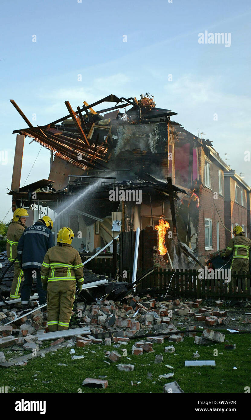 Firefighters at the scene of devastation after a suspected gas blast ...