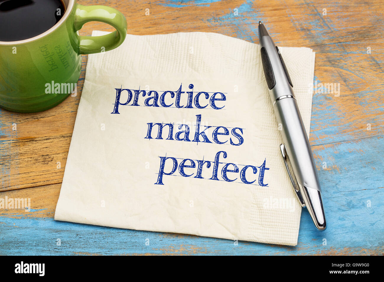 practice makes perfect - handwriting on a napkin with a cup of coffee ...