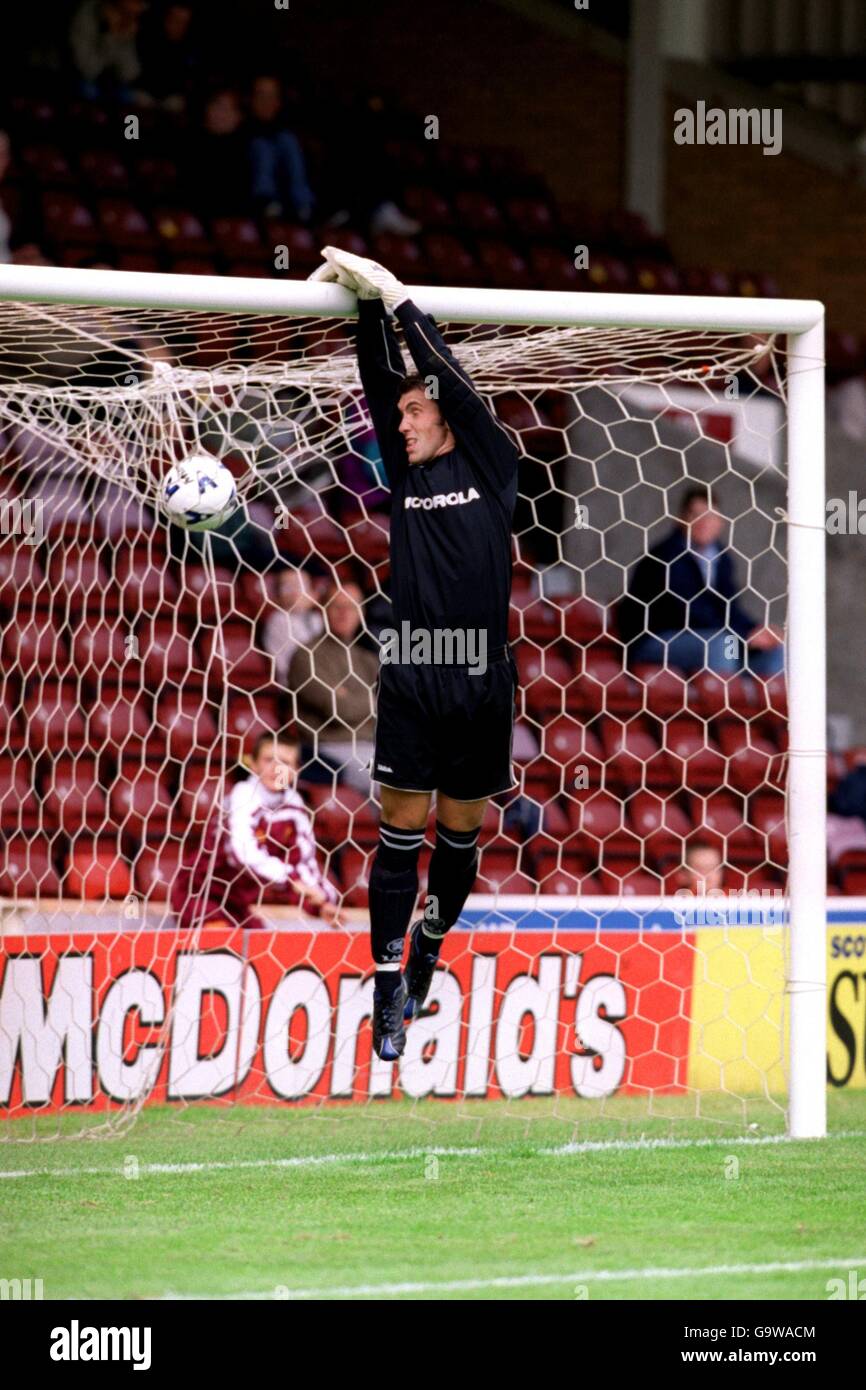 Motherwell goalkeeper Mark Brown makes sure the ball doesn't drop ...