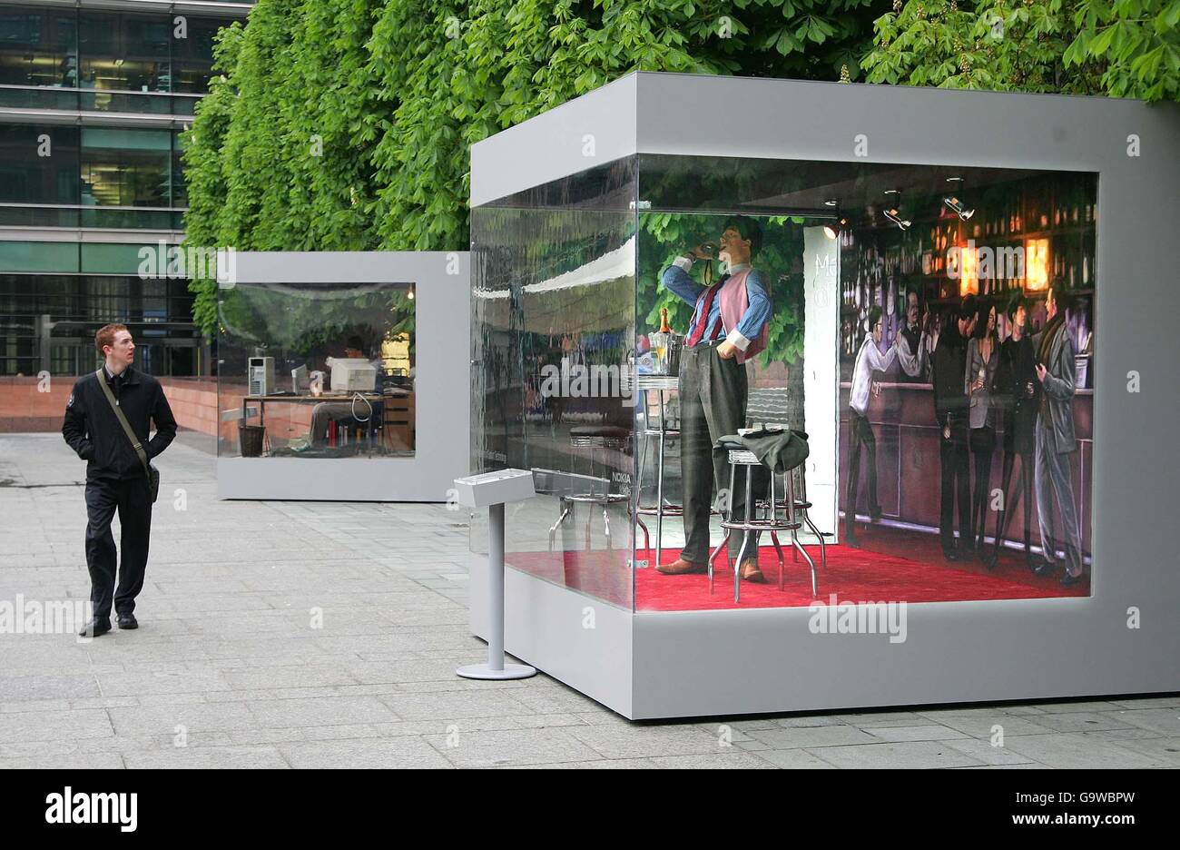 A commuter walks past the Mobile Museum of Extinct Technology at ...
