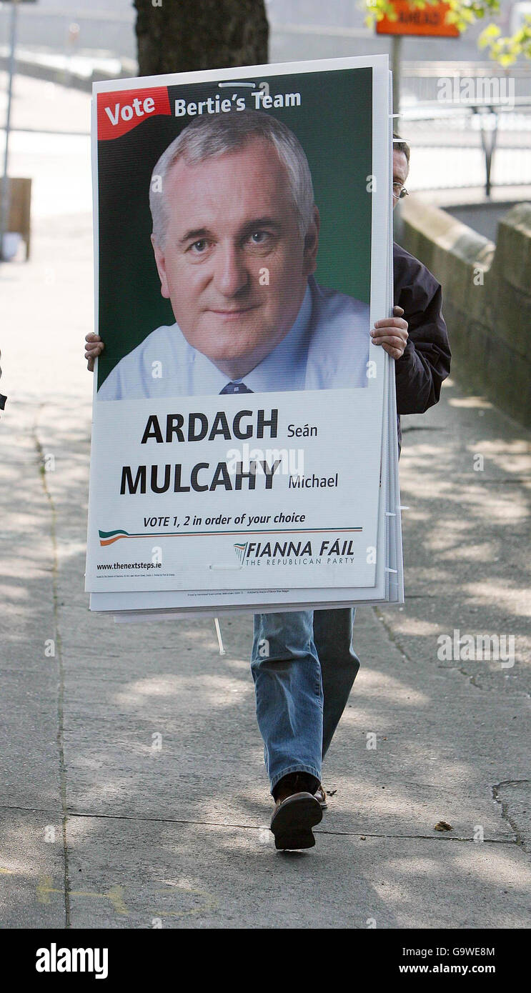 Election posters are put up along the river Liffey in Dublin, after ...