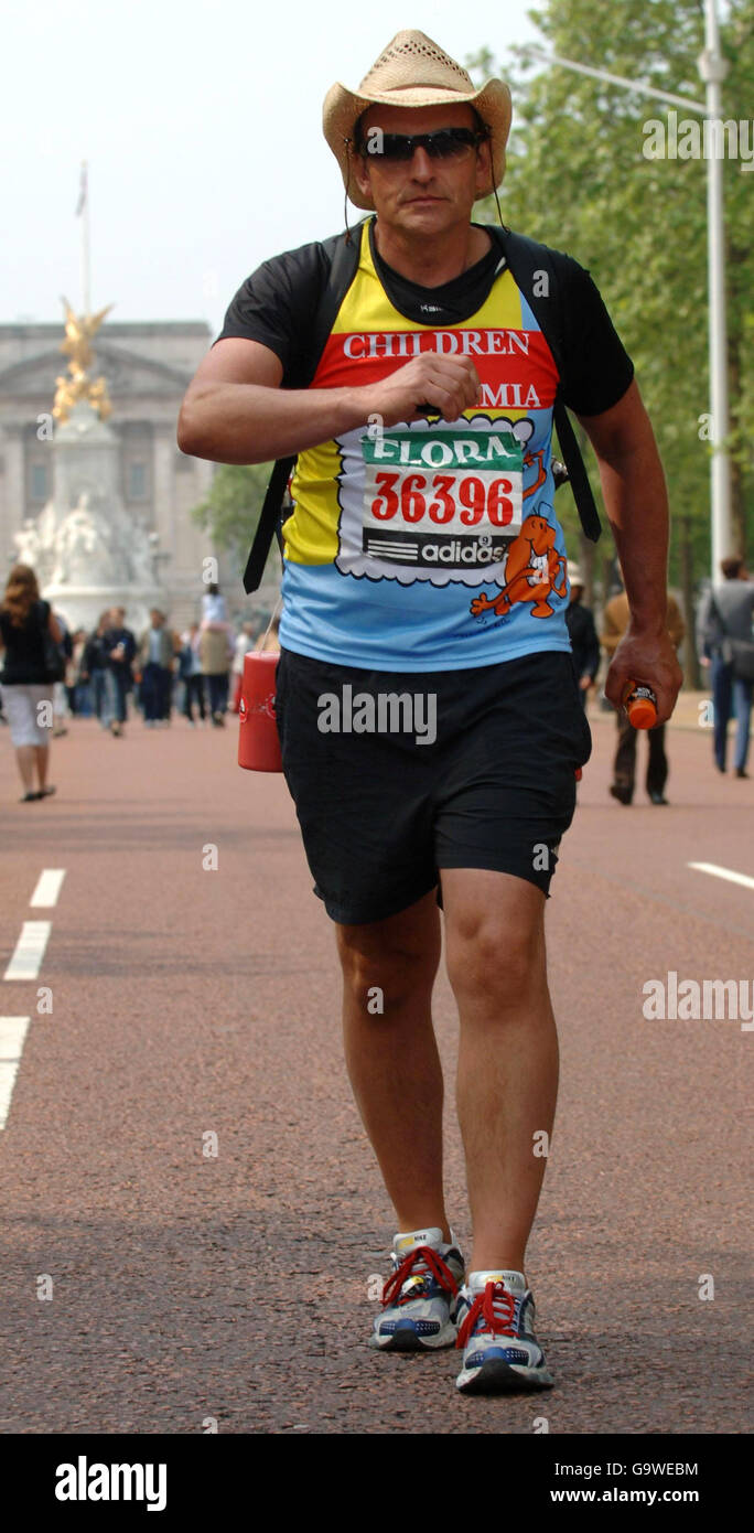 Slow motion marathon runner finishes course Stock Photo - Alamy