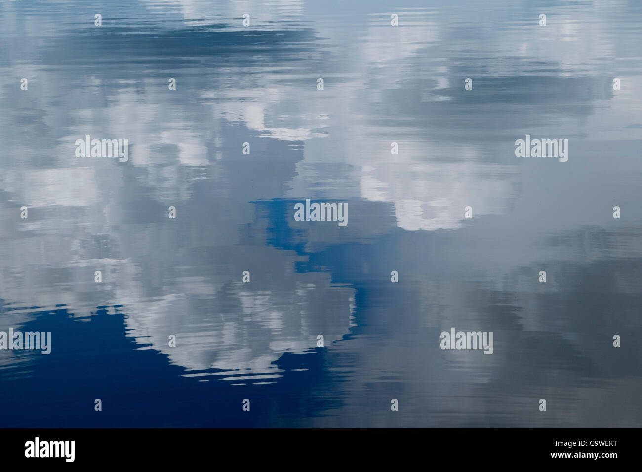 Reflections of clouds in water Stock Photo - Alamy