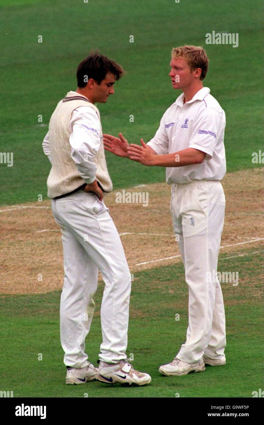 Surrey's Gareth Batty (r) has a word with Tim Murtagh (l) about his ...