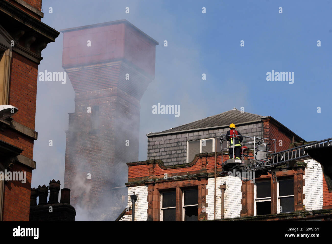 Firefighter observes smoke pouring from building on dale street hi-res ...