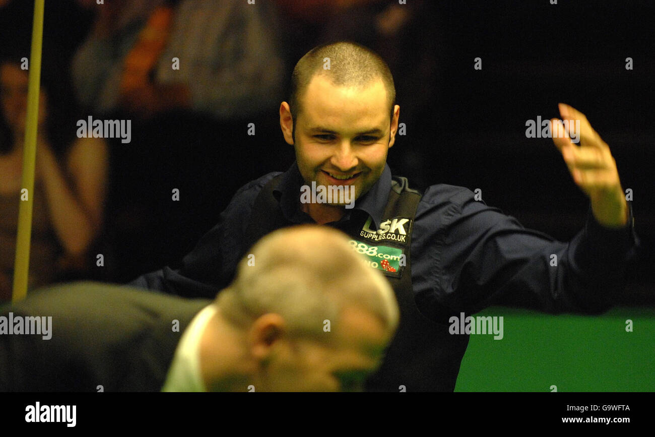 Scotland's Stephen Maguire laughs as referee Jan Verhaas ducks infront ...