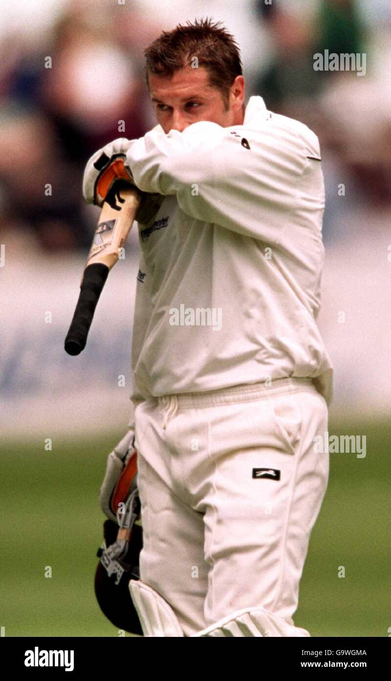 Surreys ian ward makes his way back to the pavilion hi-res stock ...
