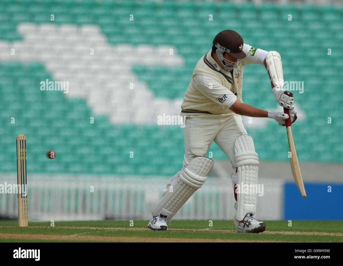 Surrey's Jimmy Ormond gets an edge and is caught behind off the bowling ...