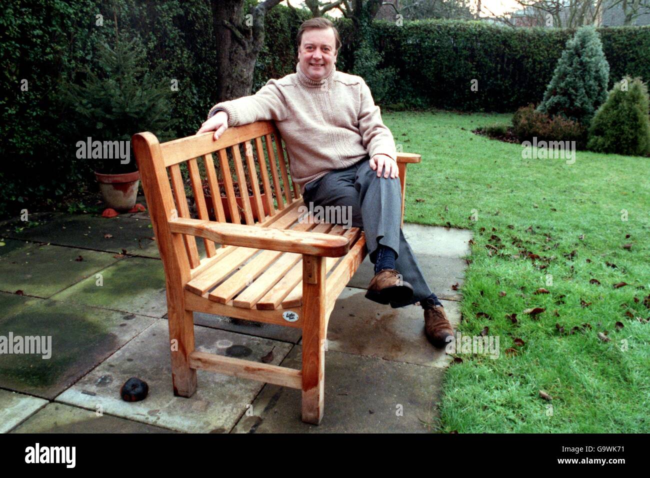 Rushcliffe MP Kenneth Clarke relaxes on a bench in his garden Stock ...