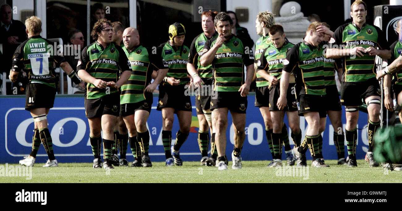 Northampton players walks off following their 27-22 win over London ...