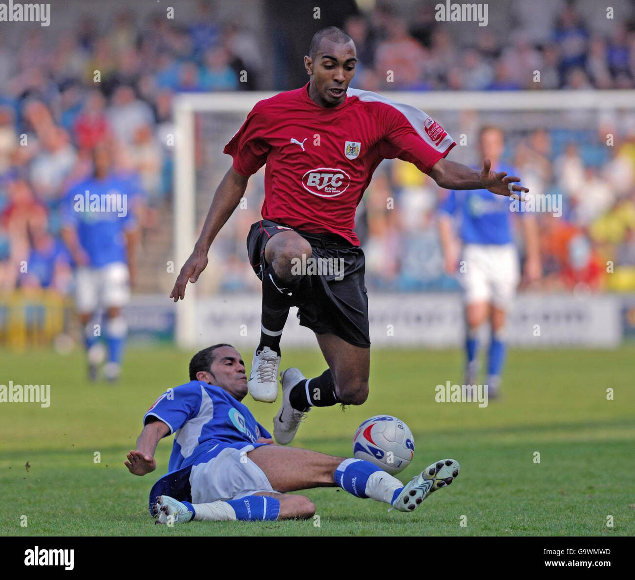 Full length action ball kicking england mangrs hi-res stock photography ...