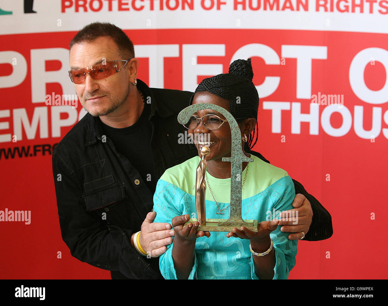 Gege Katana stands with her 2007 Front Line Award for Human Rights ...