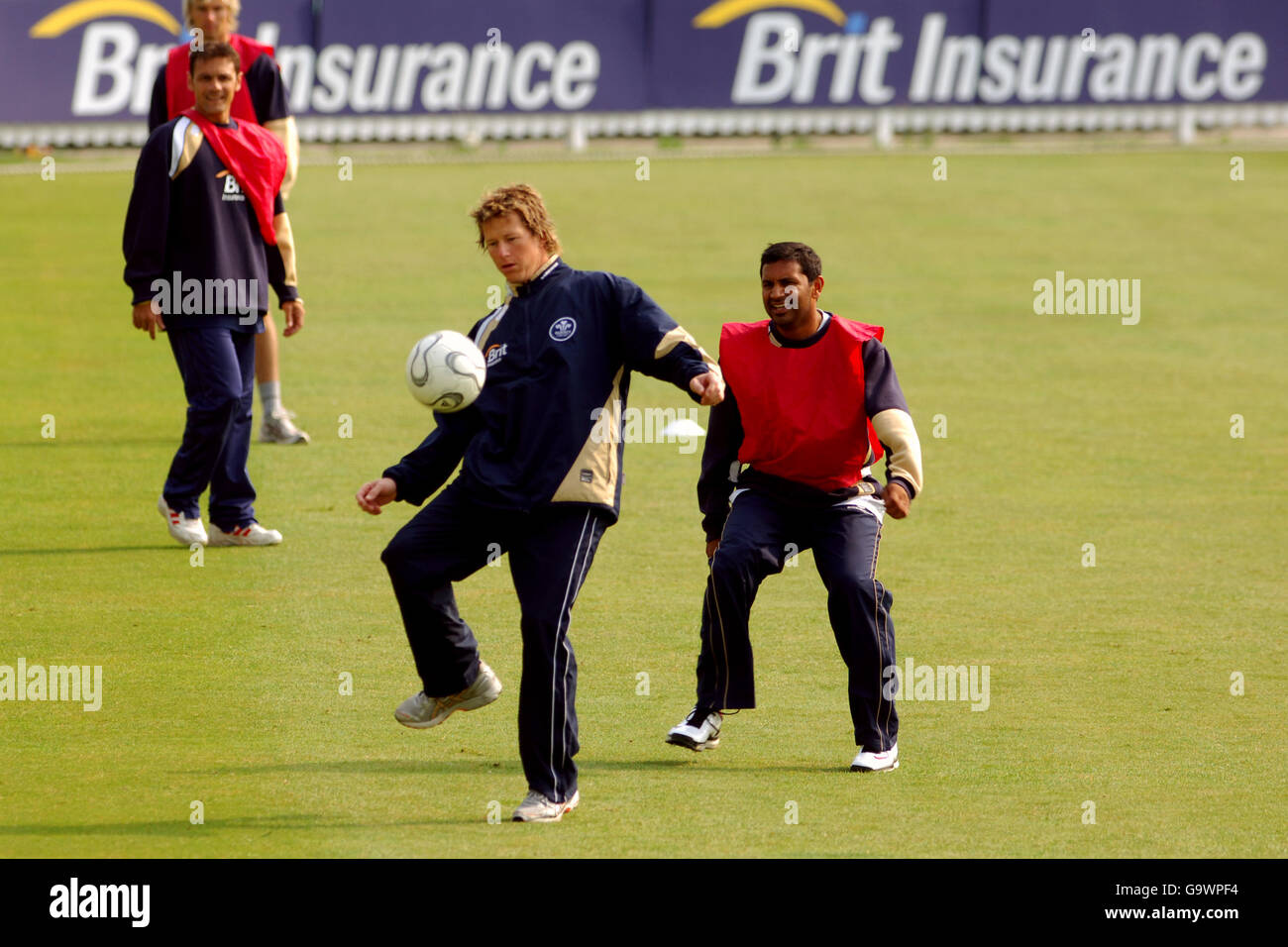 Surrey's Jonathan Batty and Nayan Doshi battle for the ball Stock Photo ...