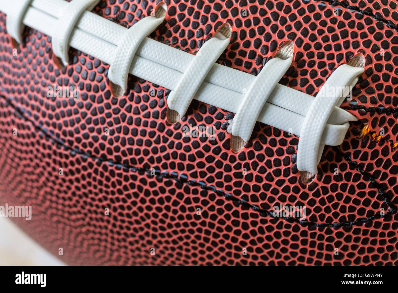 Close up of brown leather and white laces of American Football Stock ...