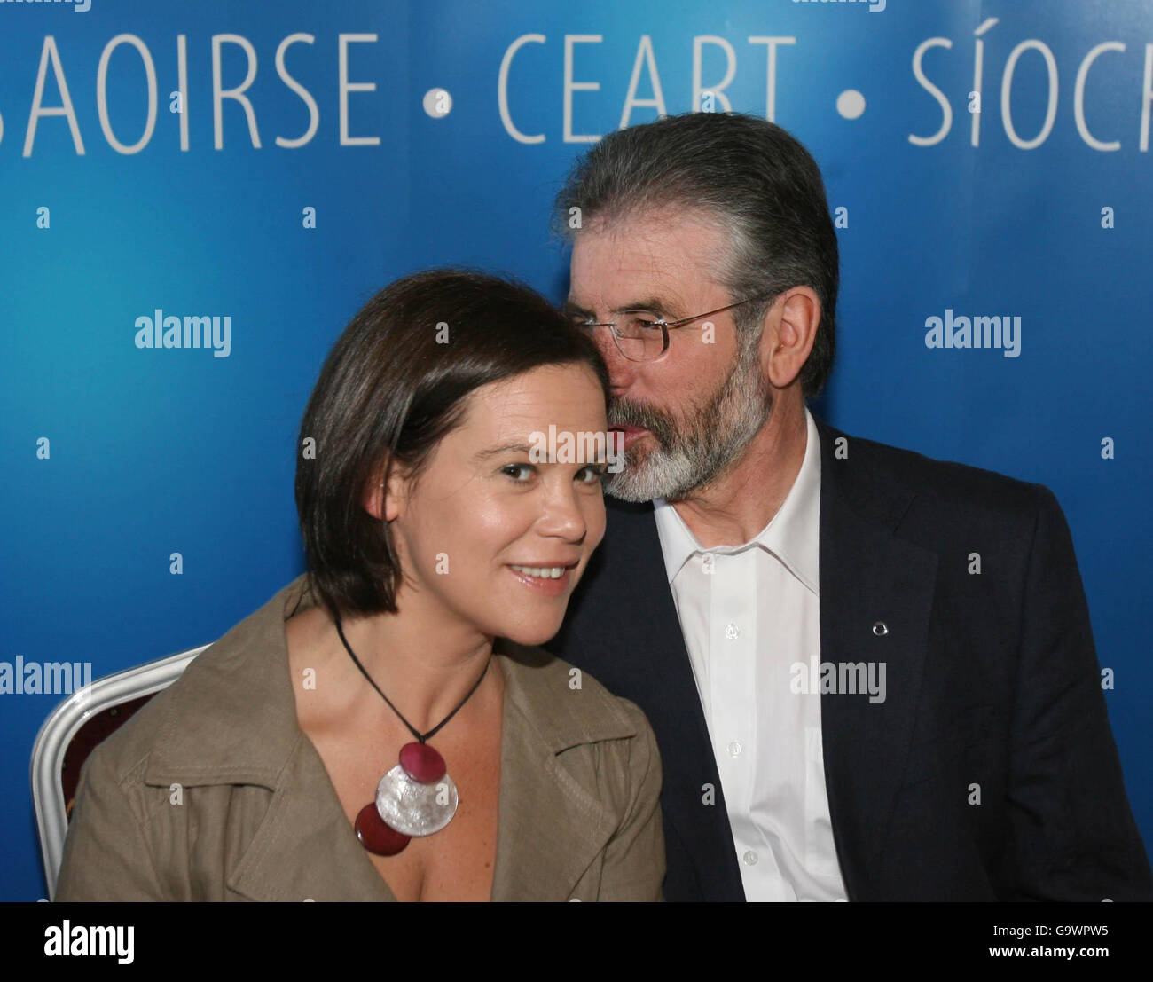 Sinn Fein candidate Mary Lou McDonald listens to Leader Gerry Adams as ...