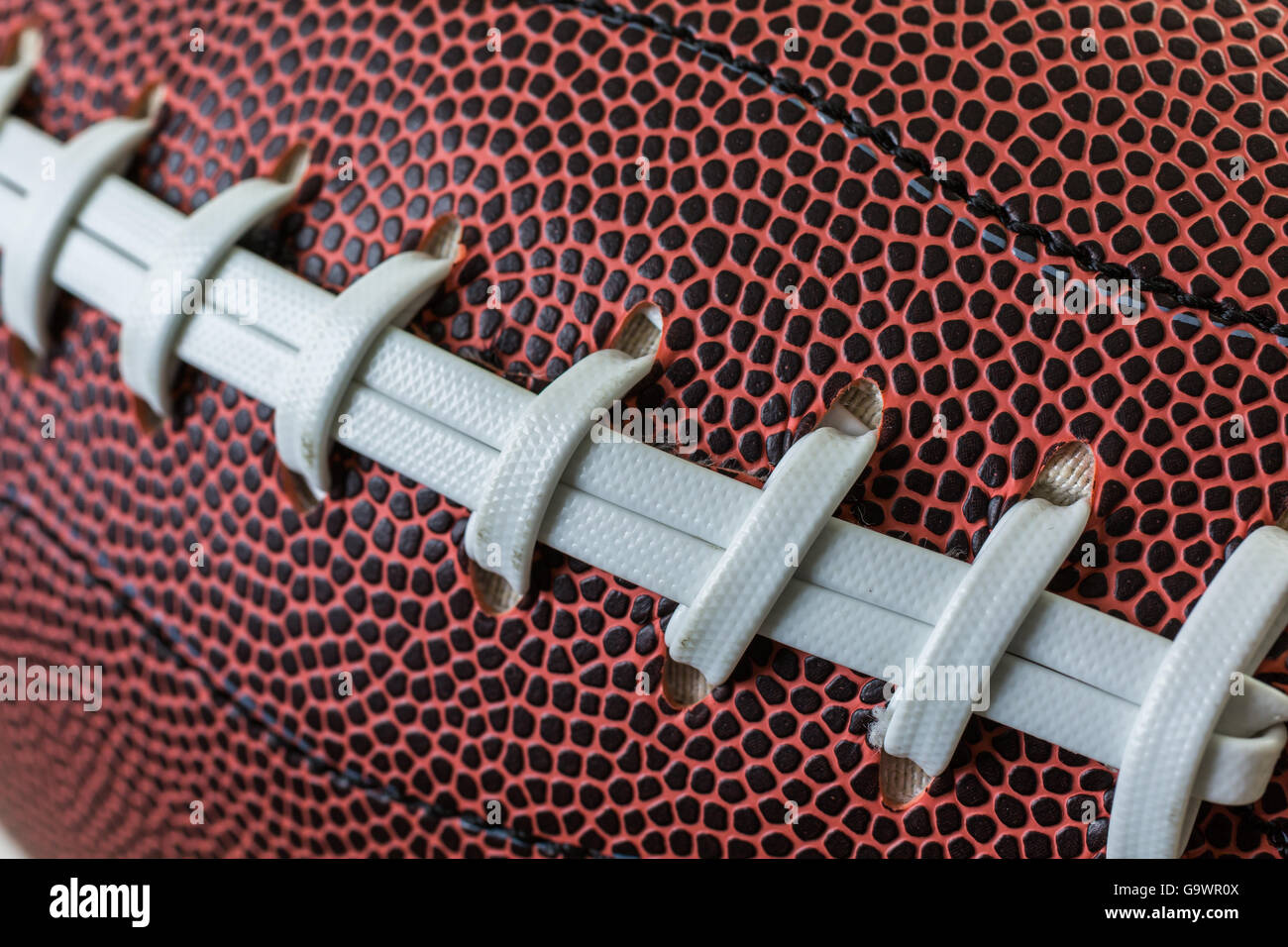 Close up of brown leather and white laces of American Football Stock ...