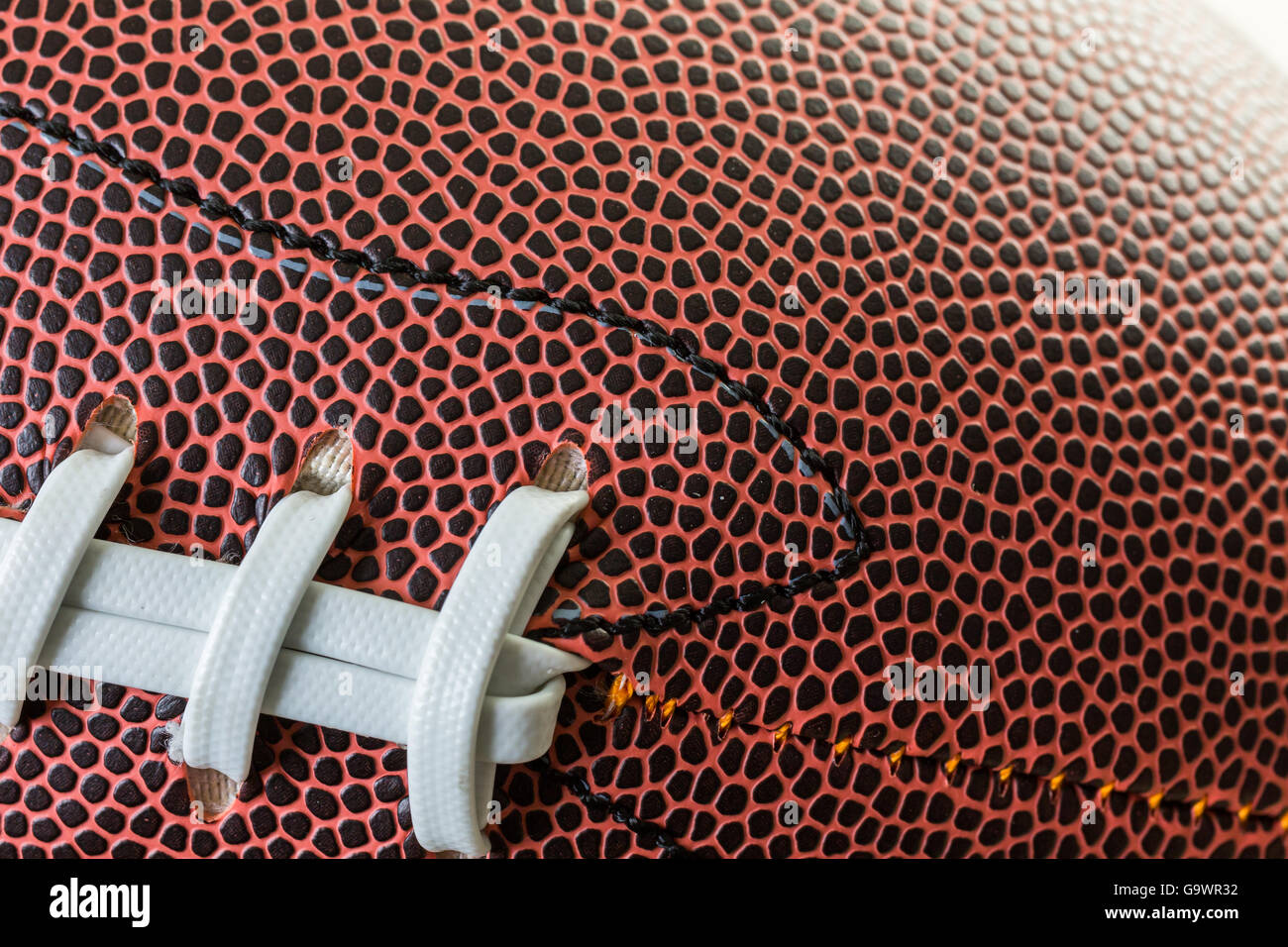 Close up of brown leather and white laces of American Football Stock ...