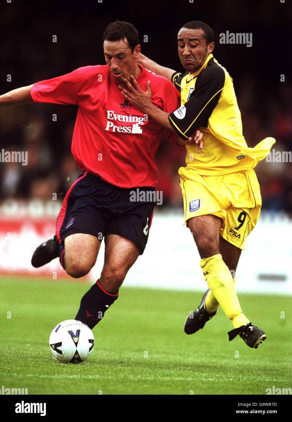 Rushden and Diamonds' Justin Jackson and York City's Gary Hobson battle for the ball Stock Photo ...