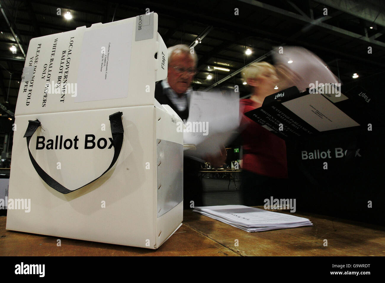 Ballot boxes are brought into Aberdeen Exhibition Centre before being ...