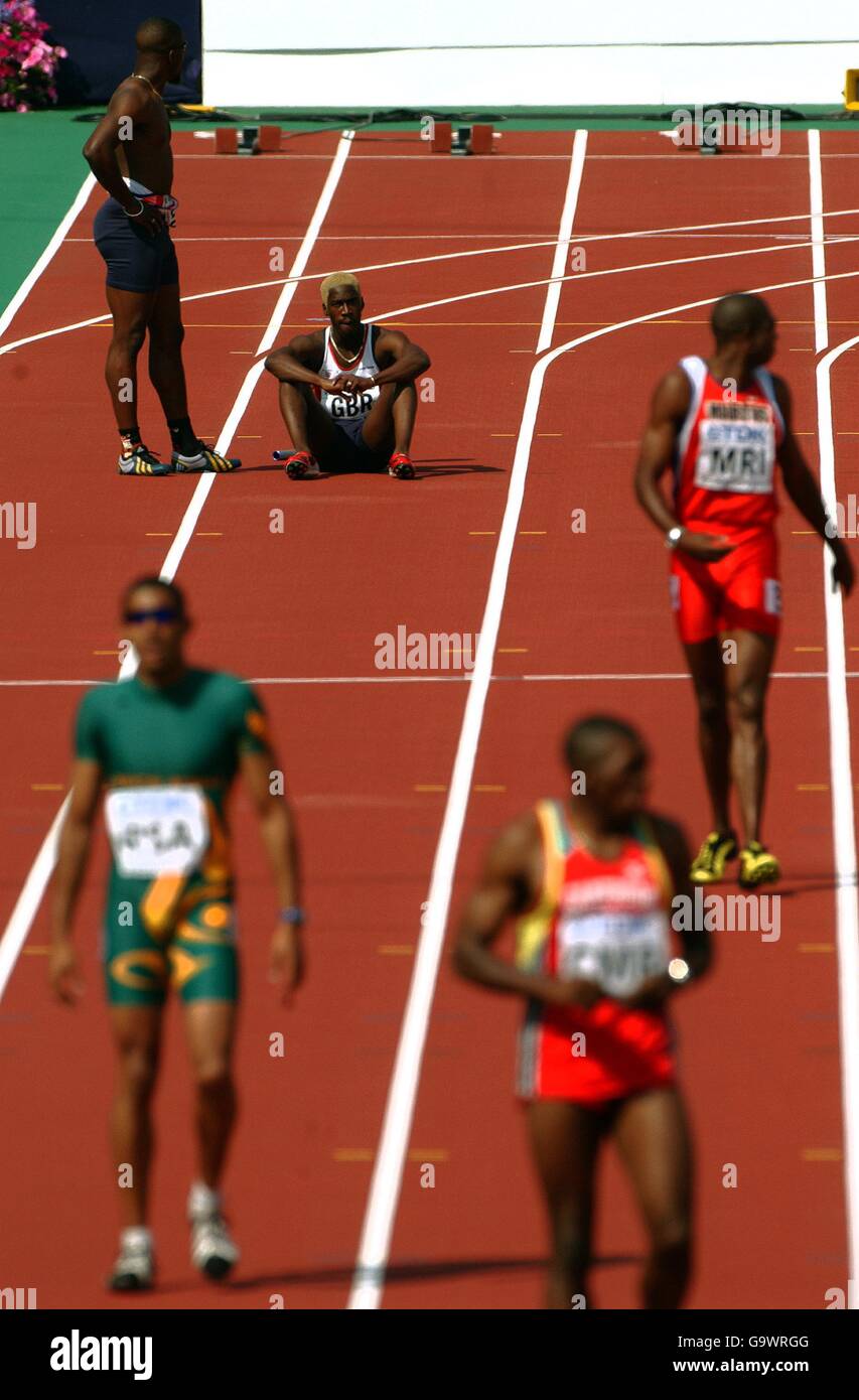 Great Britian's Jonathan Barbour and Christian Malcolm get left behind ...