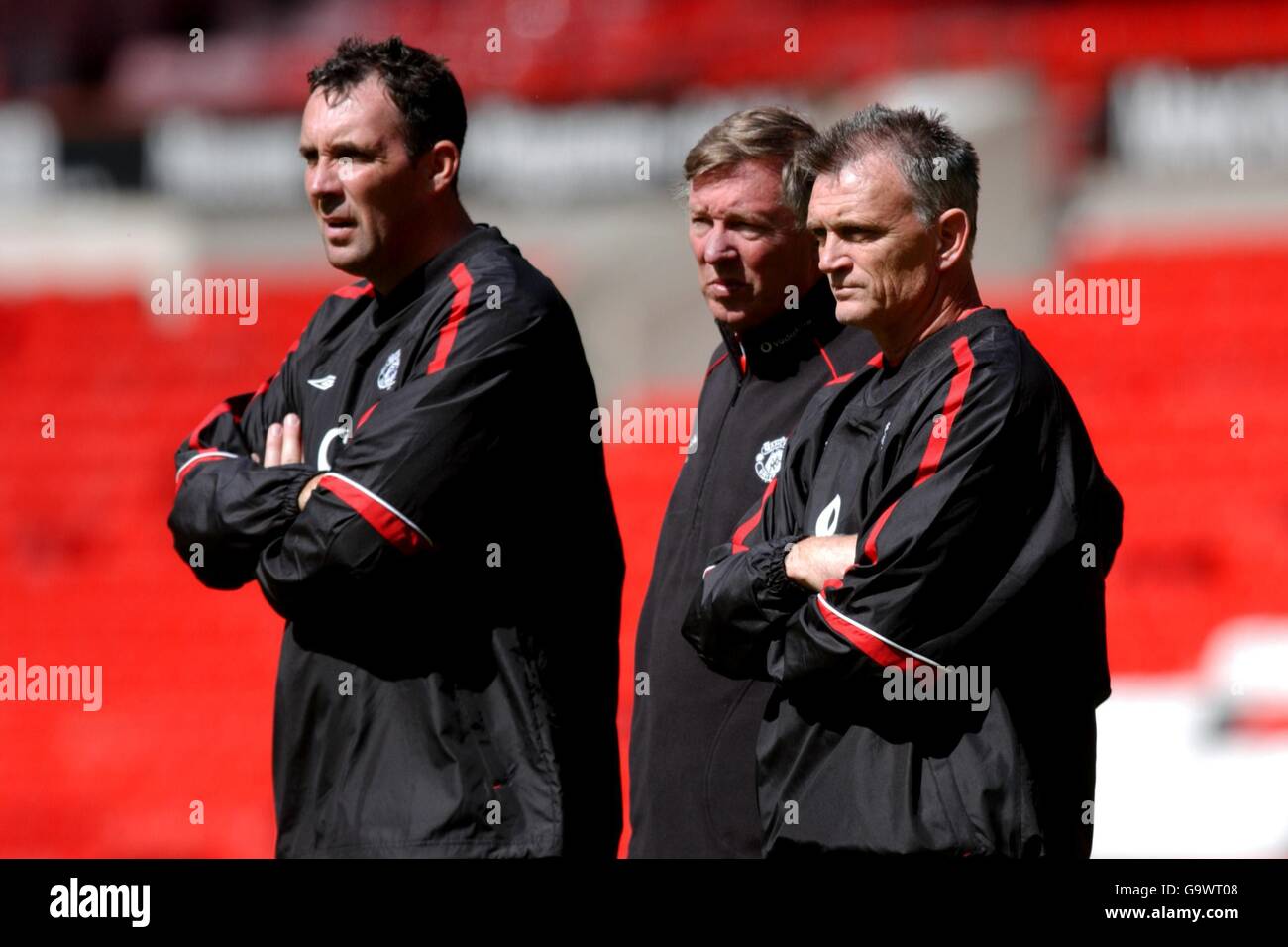l-r; Manchester United goalkeeping coach Tony Coton, manager Alex ...