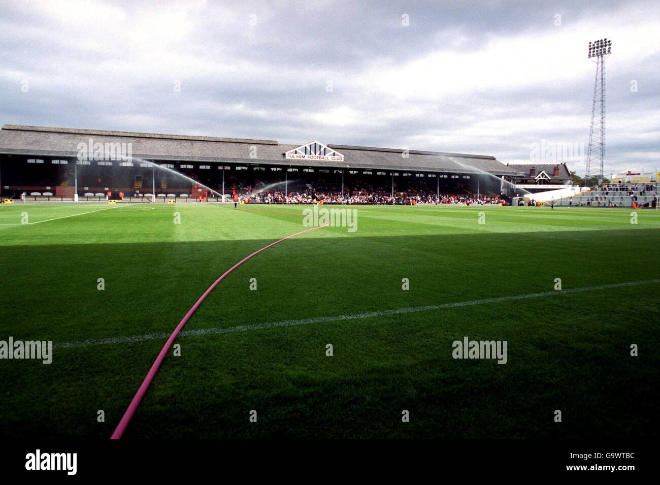 The sprinklers water the pitch at Craven Cottage, home of Fulham Stock ...
