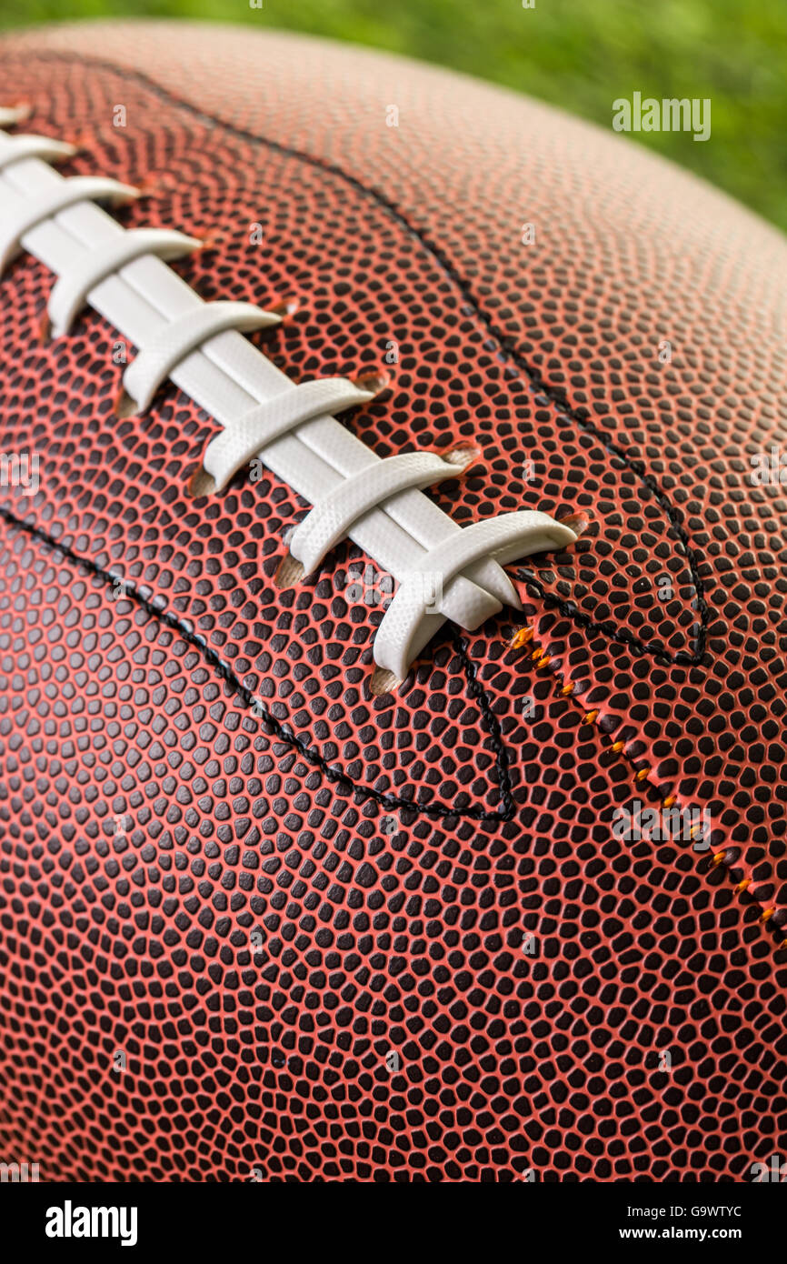 American Football Close up on on green grass Stock Photo - Alamy