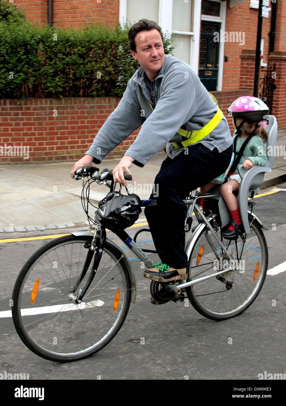 David Cameron cycles to work Stock Photo - Alamy