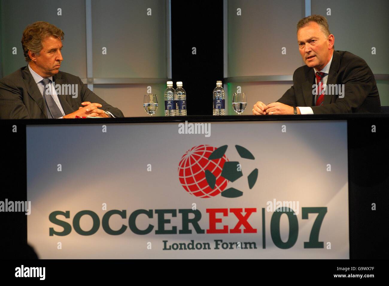 Chief Executive of the Premier League Richard Scudamore (r) is ...