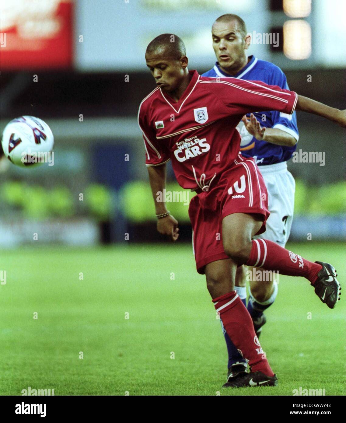 Cardiff City's Rob Earnshaw under pressure from Millwall's Robbie Ryan ...
