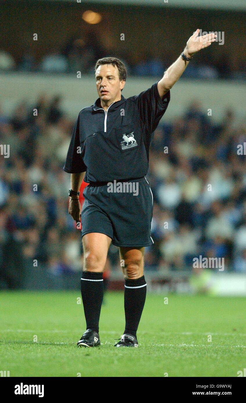 Referee Alan Wiley allows David Beckham's quickly taken free-kick which ...