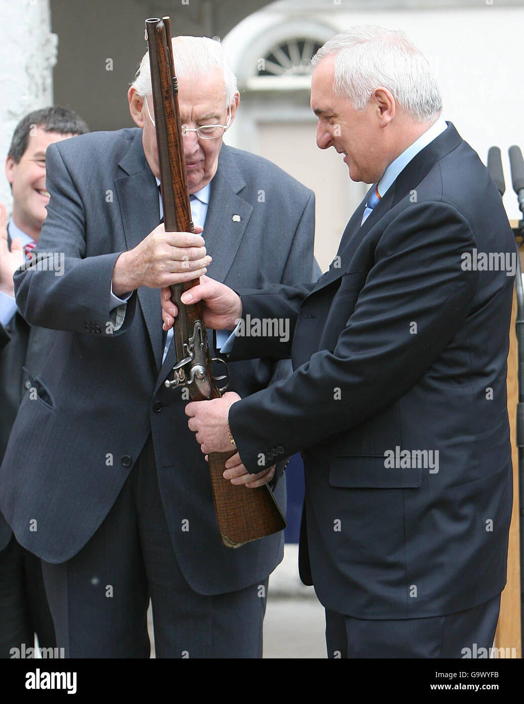 Northern Irelands First Minister Ian Paisley is handed a three hundred ...