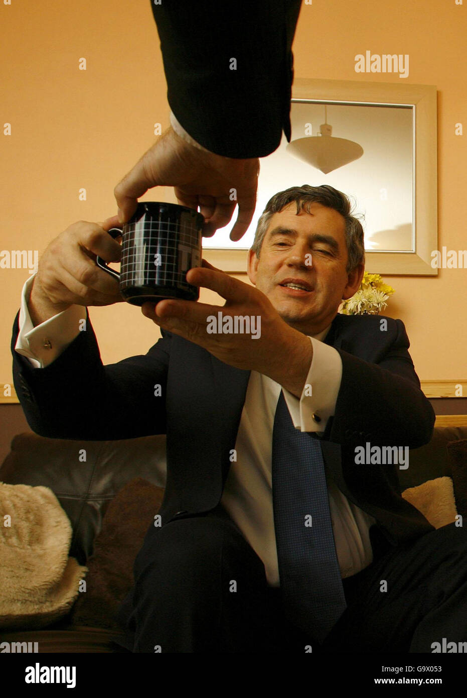 Chancellor of the Exchequer Gordon Brown takes a cup of tea from Sally ...