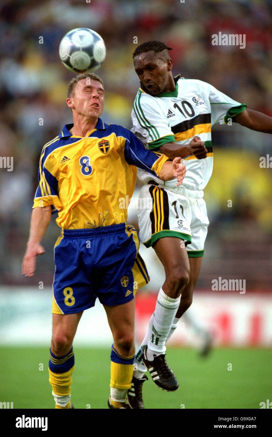 (L-R) Sweden's Fredrik Soderstrom is beaten to a header by South Africa ...