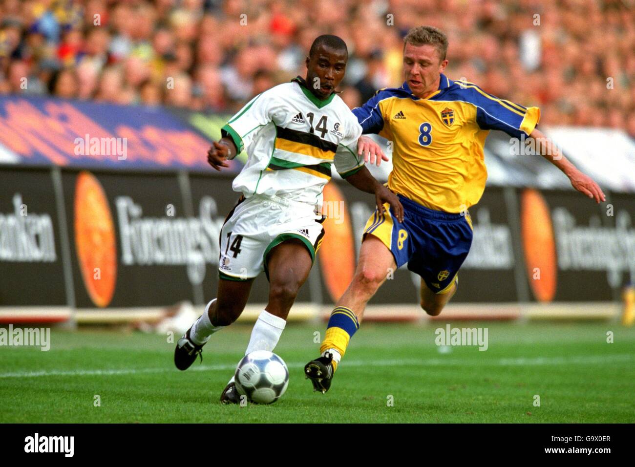 (L-R) South Africa's Siyabonga Nomvethe takes on Sweden's Fredrik ...