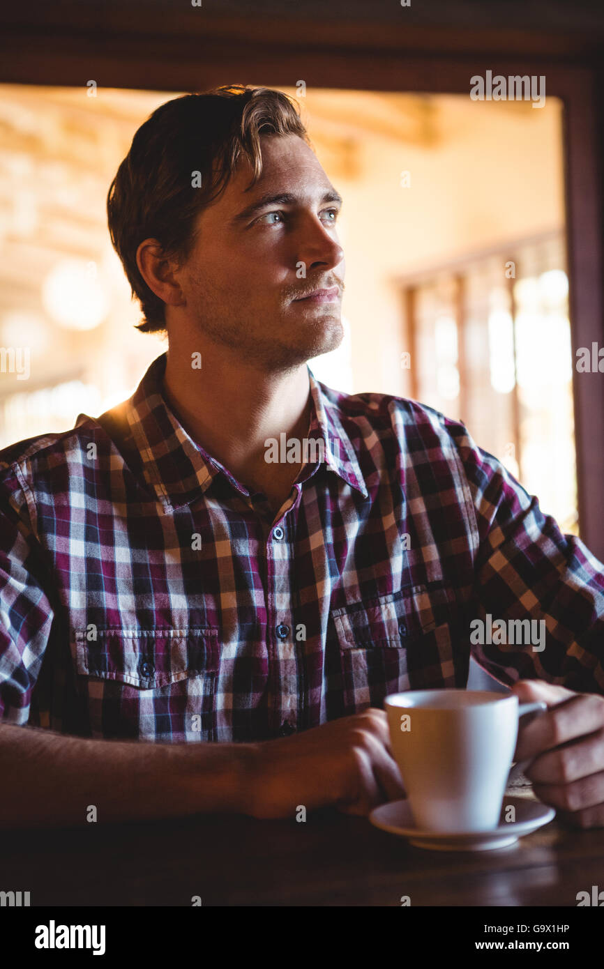 Sad man drinking a coffee Stock Photo - Alamy