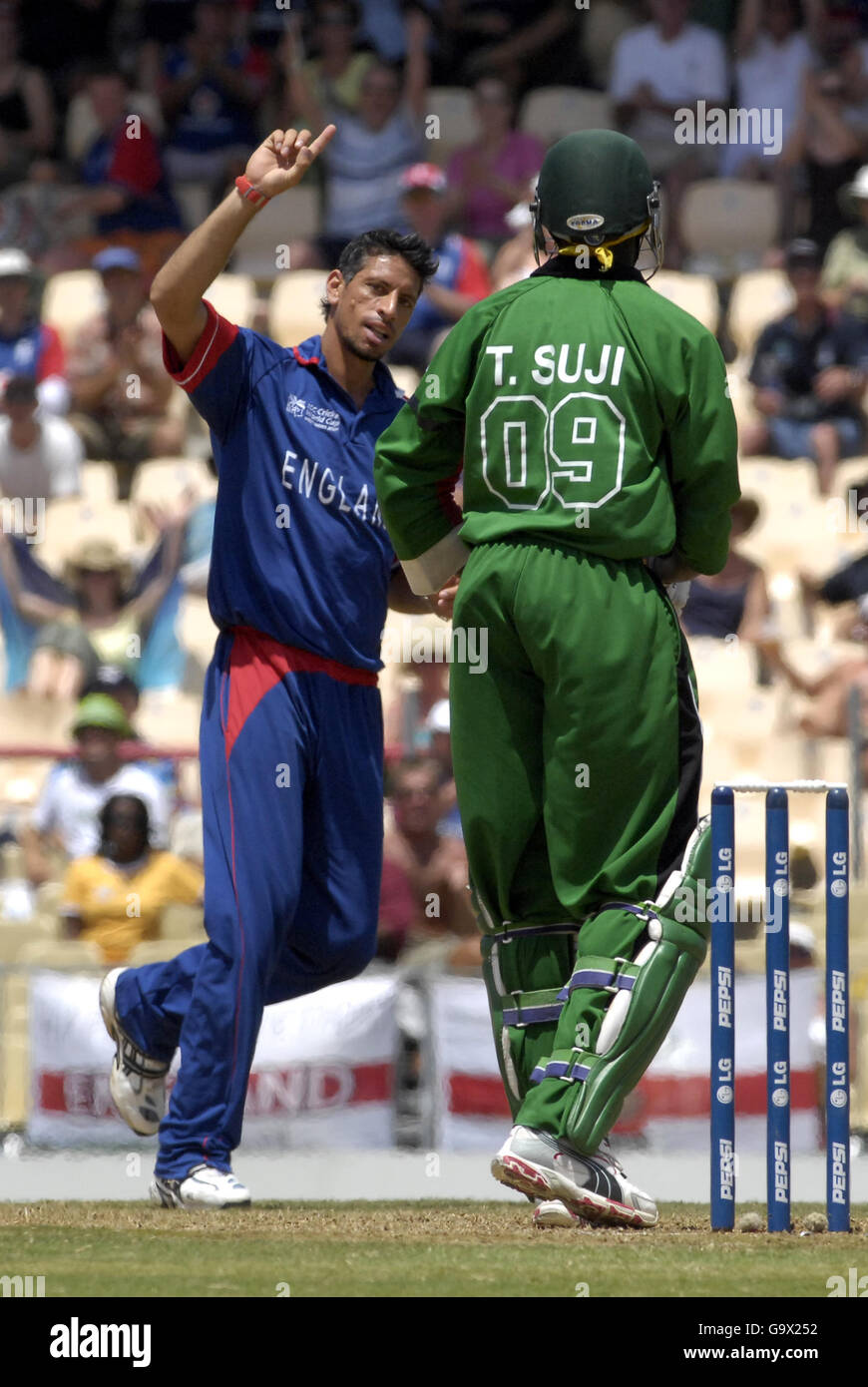 England's Sajid Mahmood (left) celebrates taking the wicket of Kenya's ...