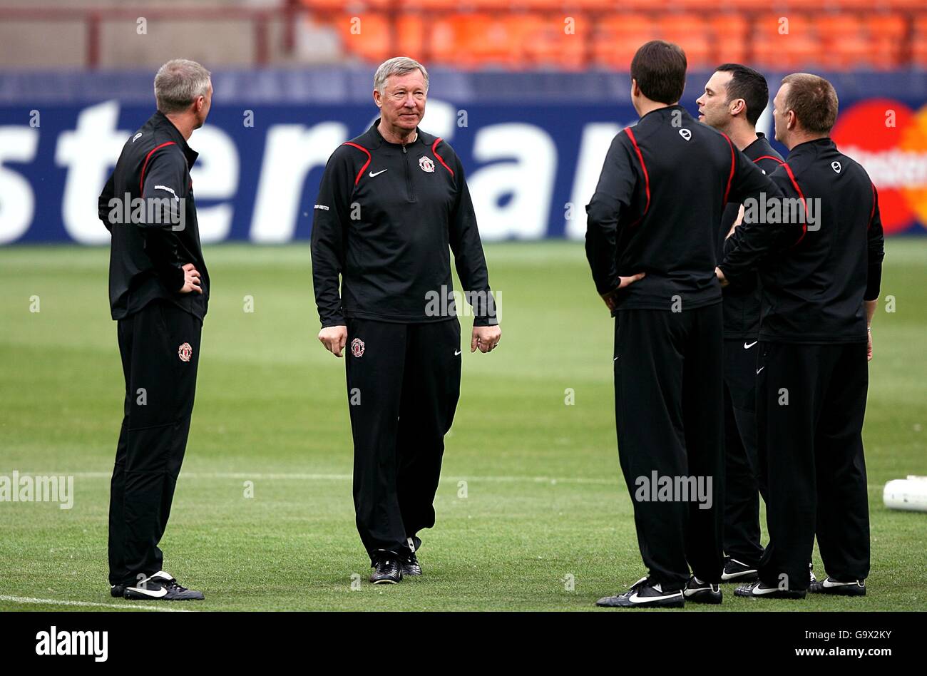 Manchester United manager Alex Ferguson (centre) with his coaching ...