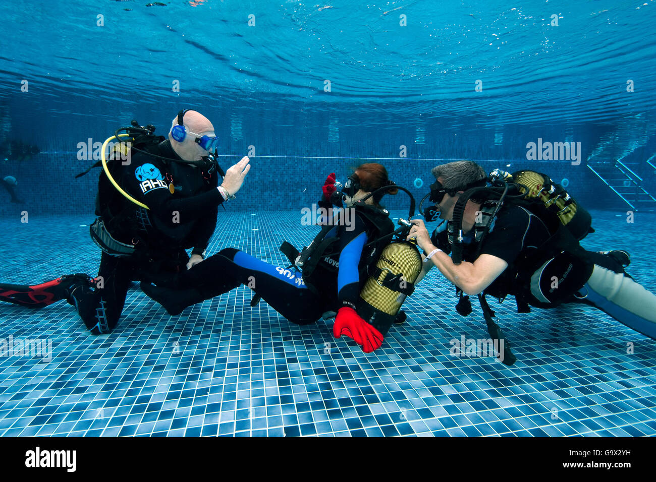 Handicapped diver with dive instructor Stock Photo - Alamy