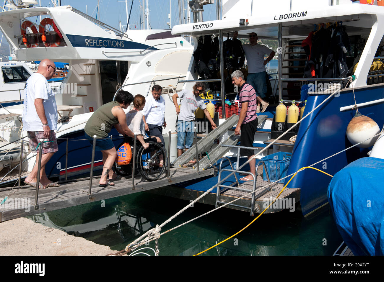 Handicapped Diver in wheel chair aboard diveboat Stock Photo - Alamy