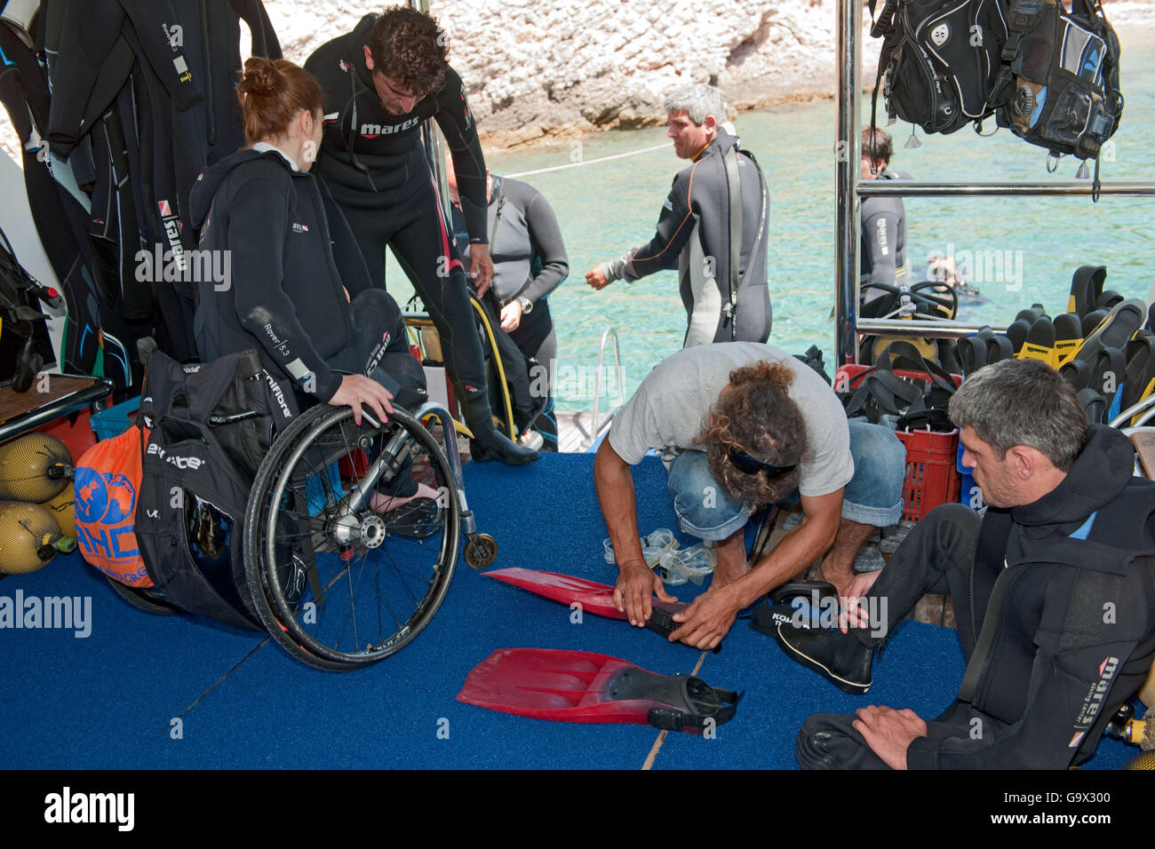 Handicapped Diver in wheel chair aboard diveboat Stock Photo - Alamy