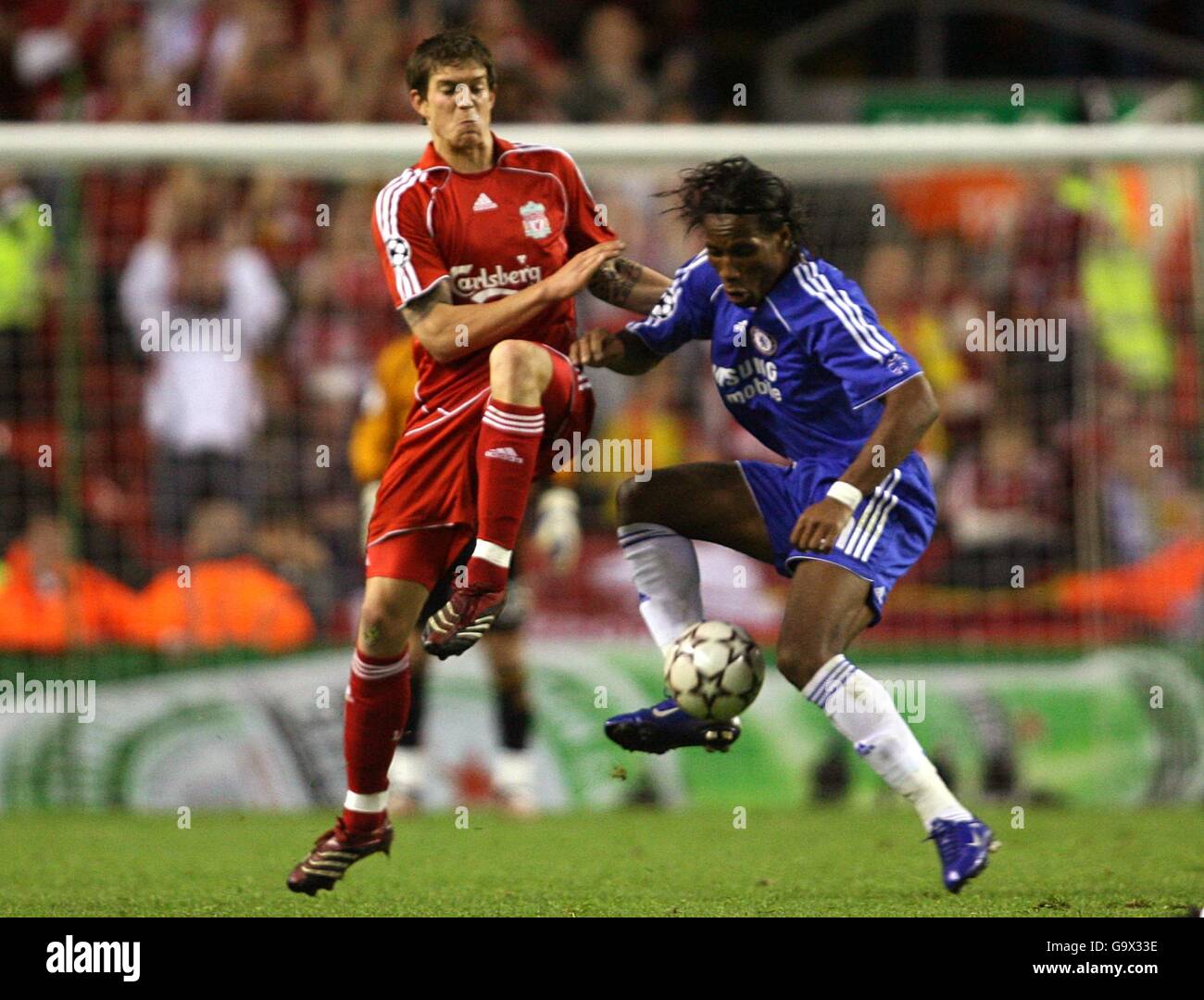 Chelsea's Didier Drogba (right) and Liverpool's Daniel Agger battle for ...