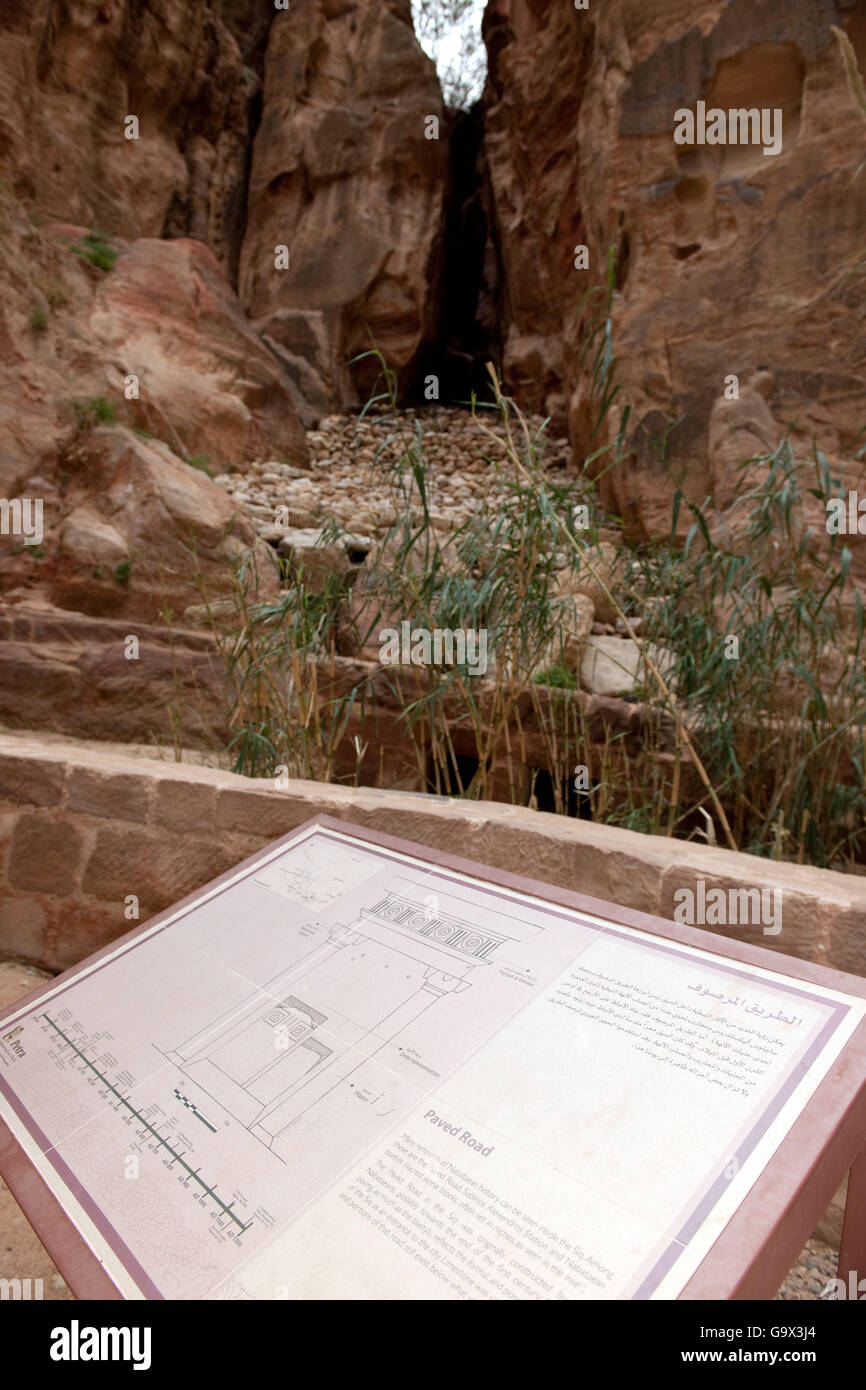 ancient nabataean dam in Siq against flood, information plate for paved ...