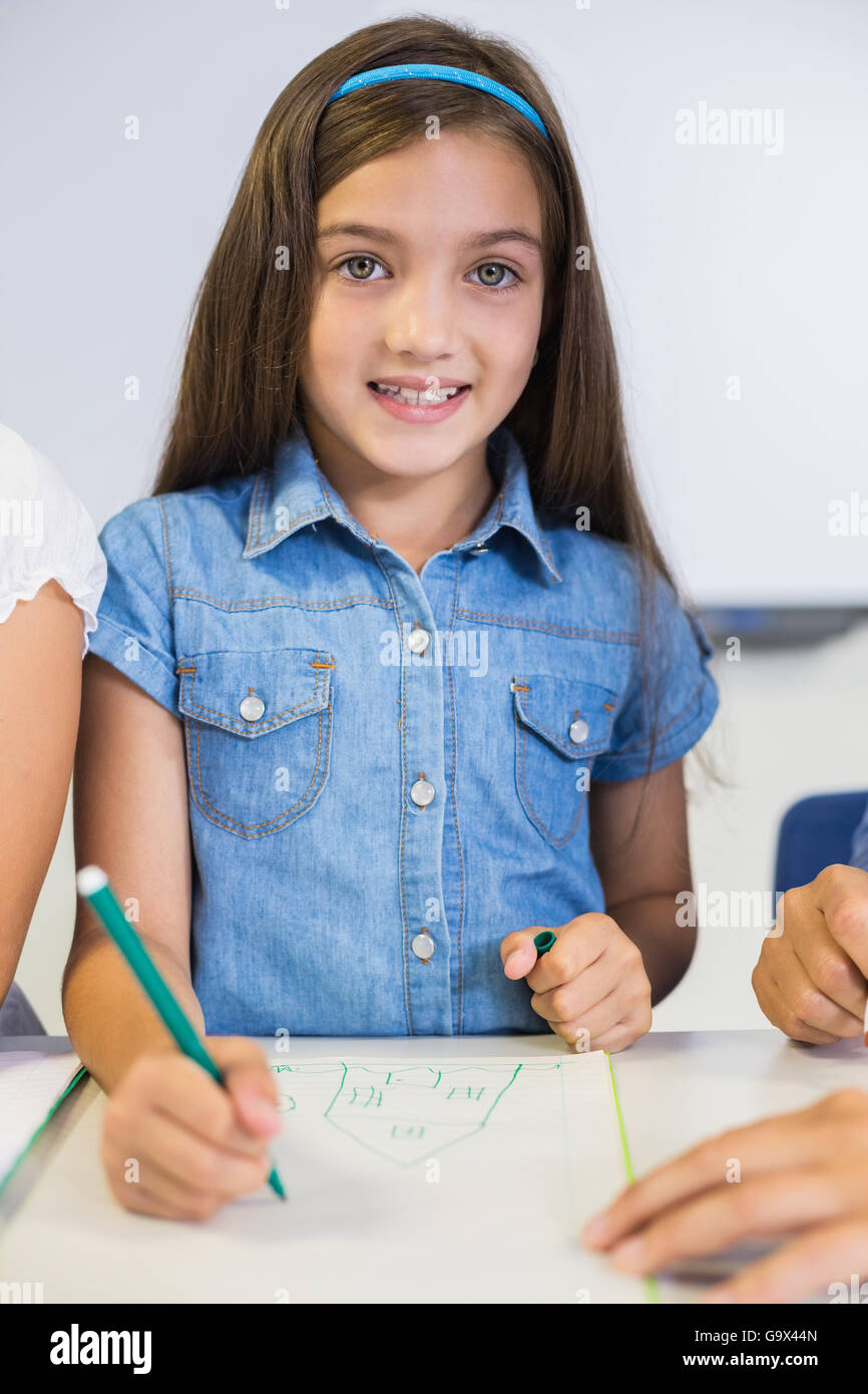 Cute girl drawing in book hi-res stock photography and images - Alamy