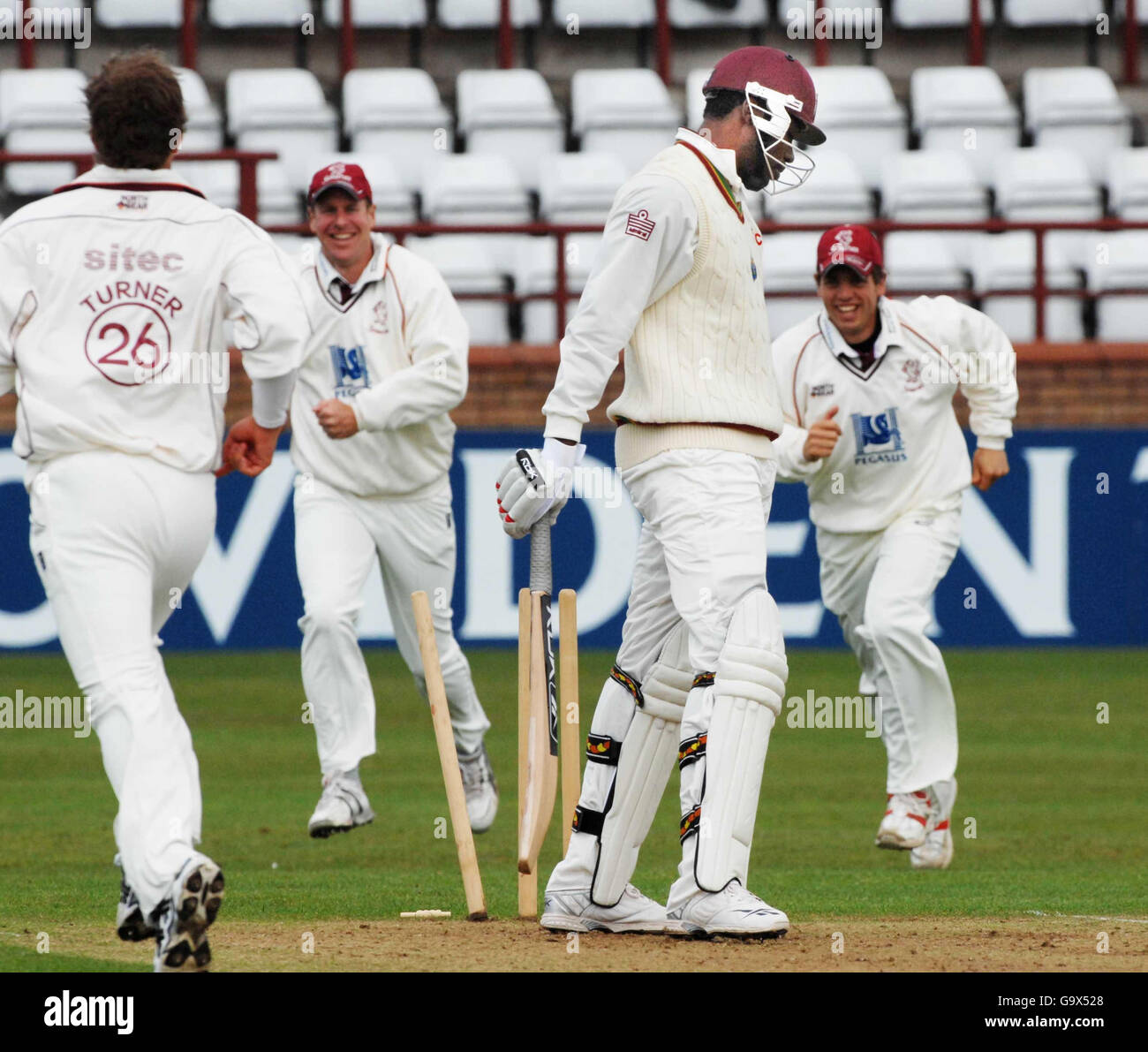 Somerset bowler Mark Turner (left) runs forward to celebrate with his ...