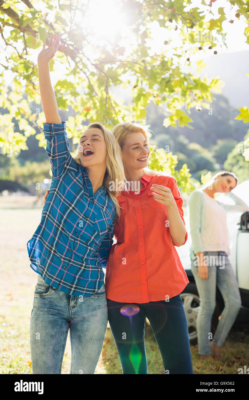 Beautiful women having a fun in park Stock Photo - Alamy