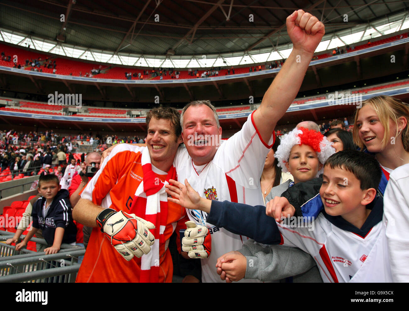 Stevenage Borough goalkeeper Alan Julian celebrates with his family ...
