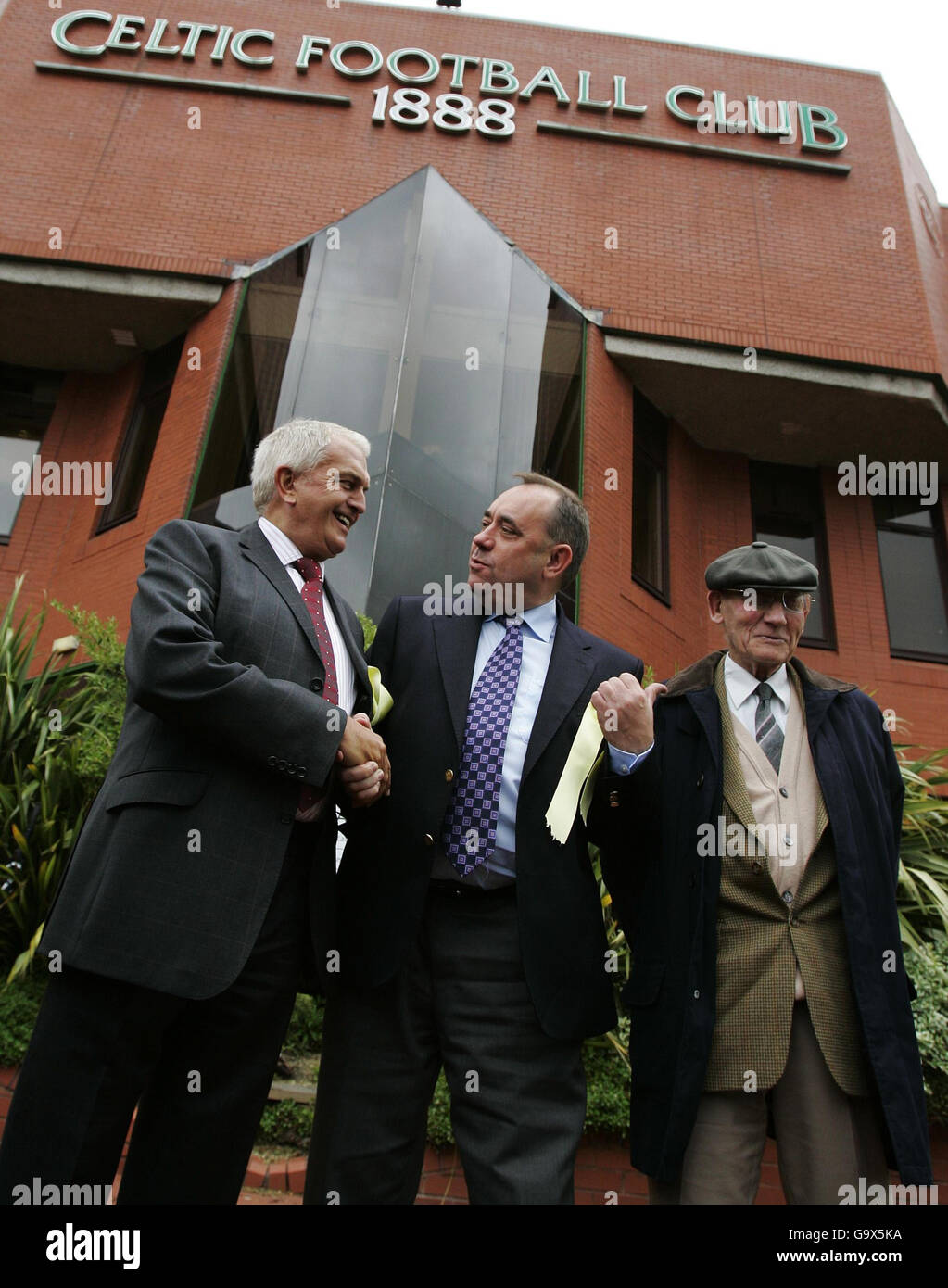 SNP leader Alex Salmond (centre) shakes hands with Brian Dempsey, as he arrives with his father ...